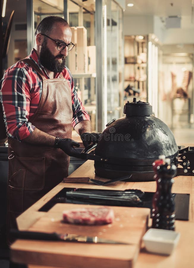 Chef Preparing Ceramic Grill for a Steak in a Restaurant Stock Photo ...