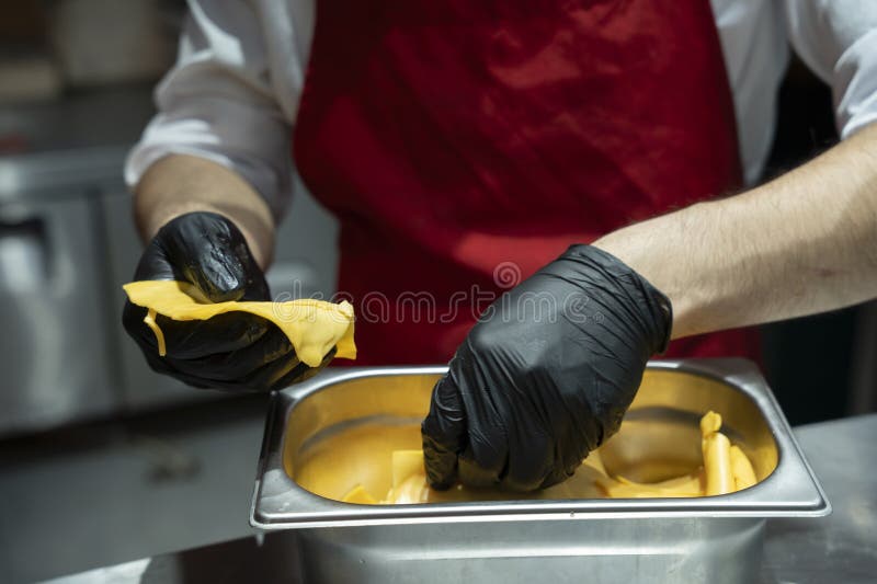 Chef Preparing Cheddar Cheese Slices for Gourmet Burgers Stock Photo ...