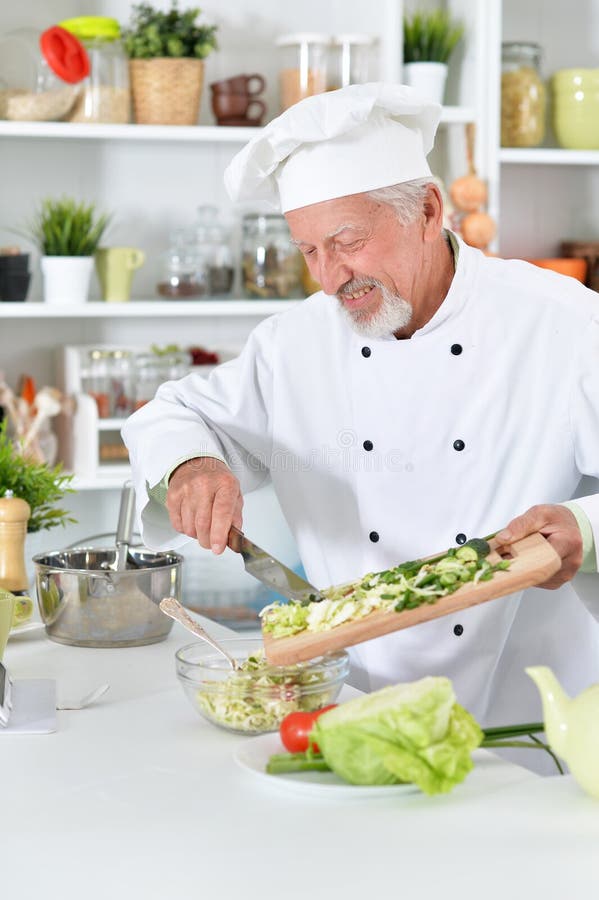 Chef preparing dinner stock photo. Image of generation - 96910260