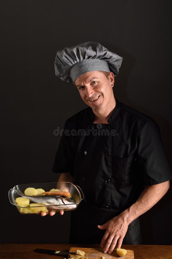 Chef Preparing a Fish Dish with Garnish Stock Photo - Image of ...