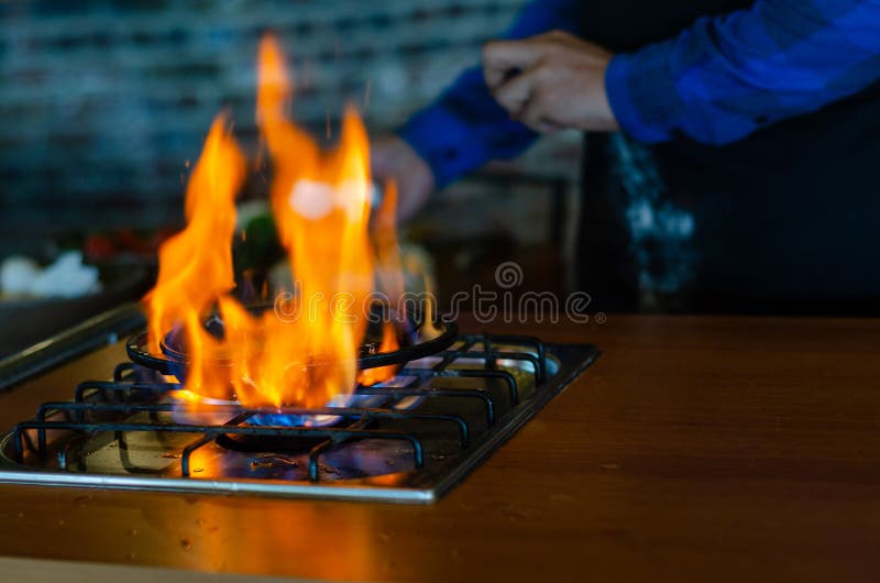 Chef is Preparing a Flambe Dish in Restaurant. Stock Image - Image of ...