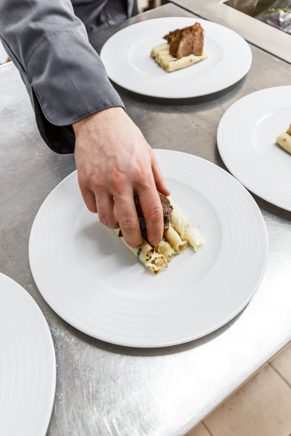 Chef preparing a meal stock image. Image of restaurant - 87491775