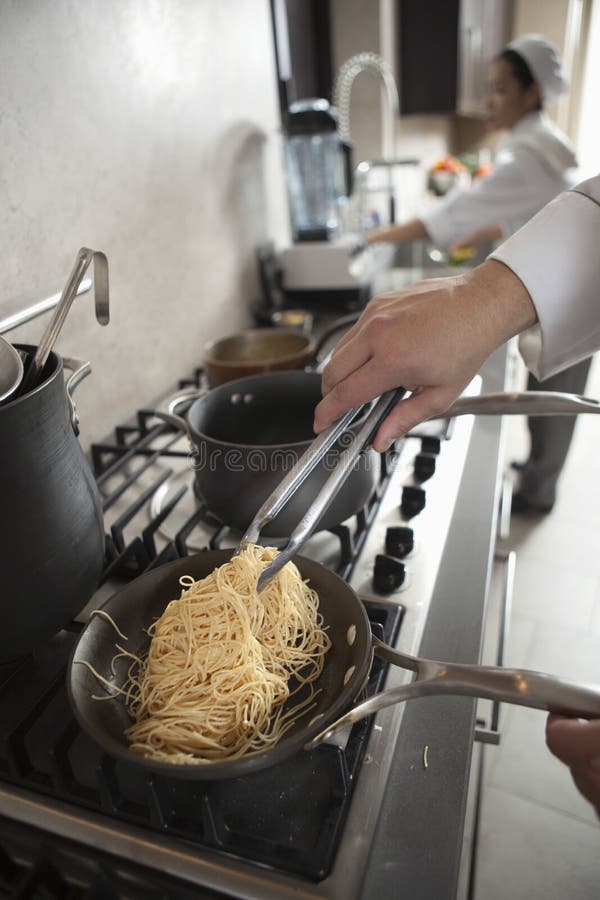 Chef Preparing Spaghetti in Kitchen Stock Image - Image of occupation ...
