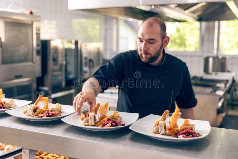 Chef preparing starters stock photo. Image of prepare - 250679180