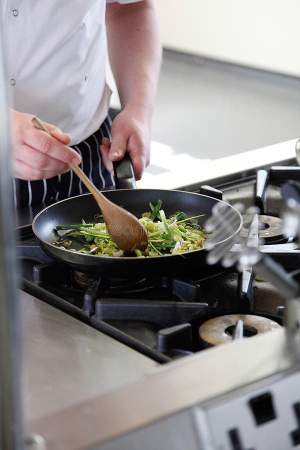 Chef Preparing Vegetables on a Pan in the Kitchens at Greencore ...