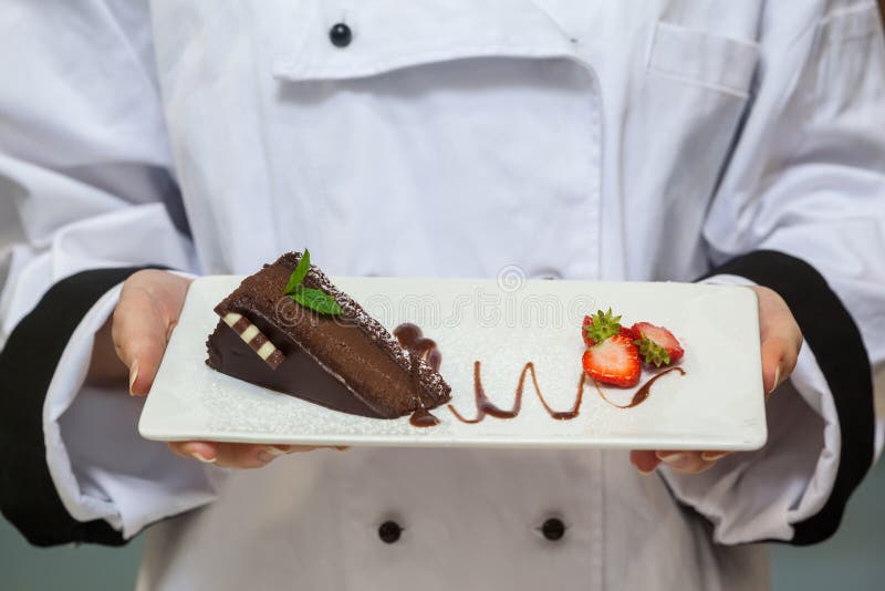 Chef Presenting Chocolate Cake with Strawberries Stock Photo - Image of ...