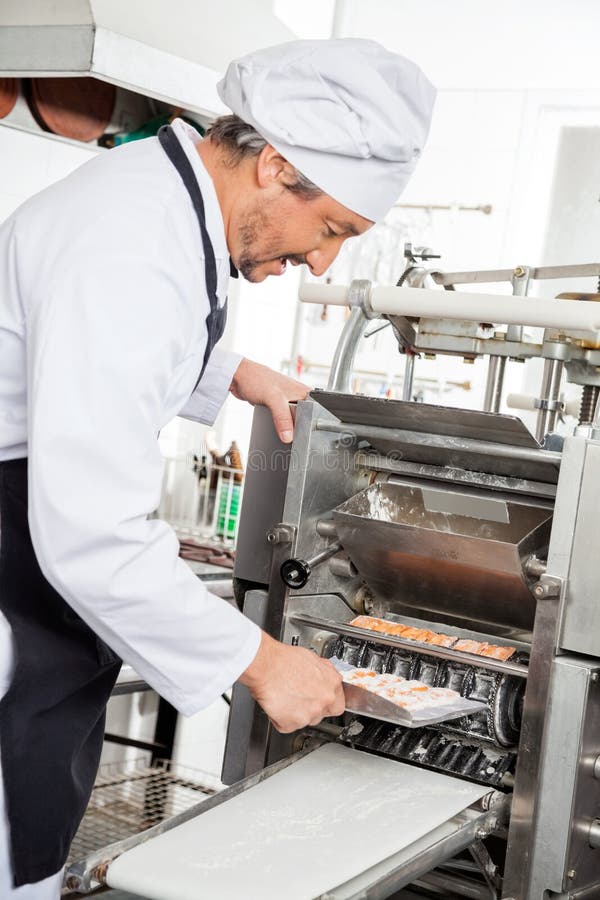 Chef Processing Ravioli Pasta in Machine Stock Photo - Image of ...