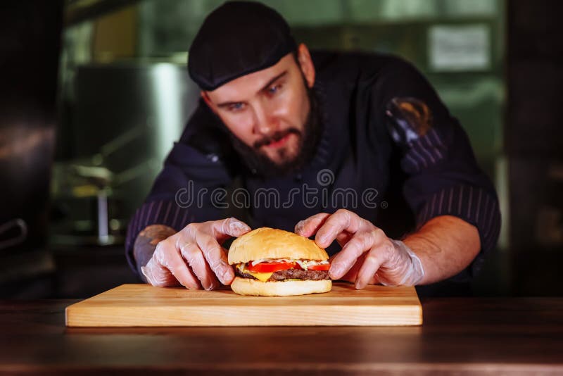 Chef Putting Bun on Top,he Making a Beef Burger for Customer Order ...