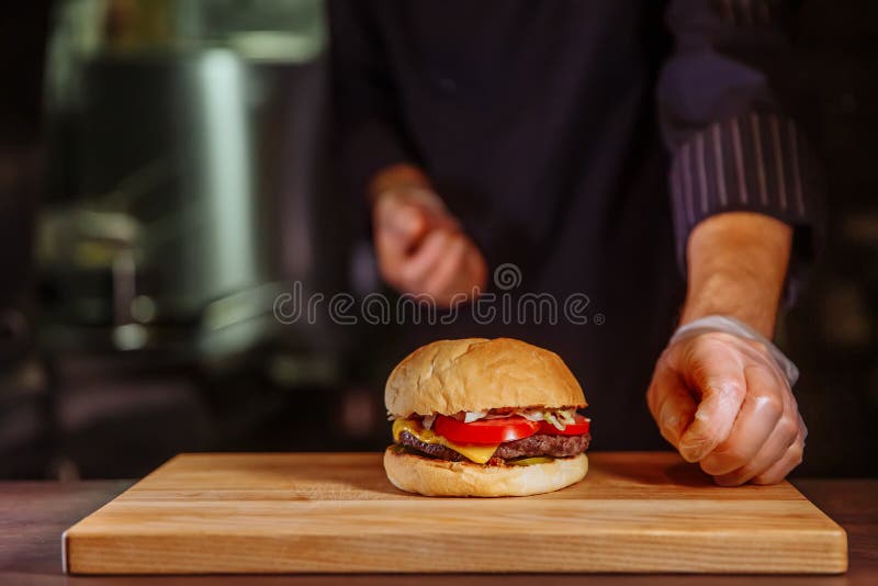 Chef Putting Bun on Top,he Making a Beef Burger for Customer Order ...