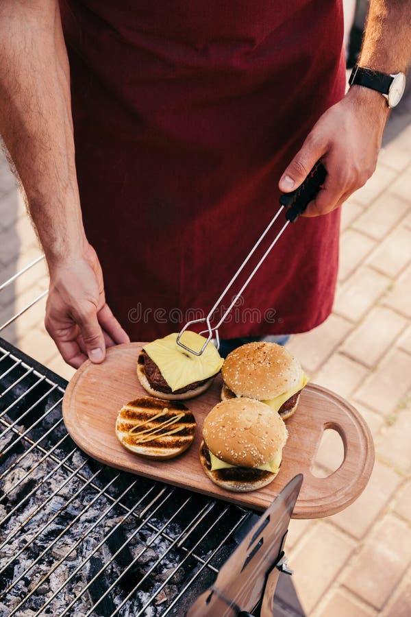 Chef Putting Cheese on Hamburgers for Outdoors Barbecue Stock Photo ...