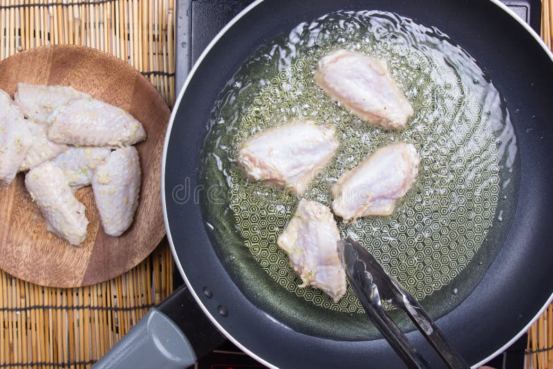 Chef Putting Chicken Wings for Fring in Pan Stock Photo - Image of ...