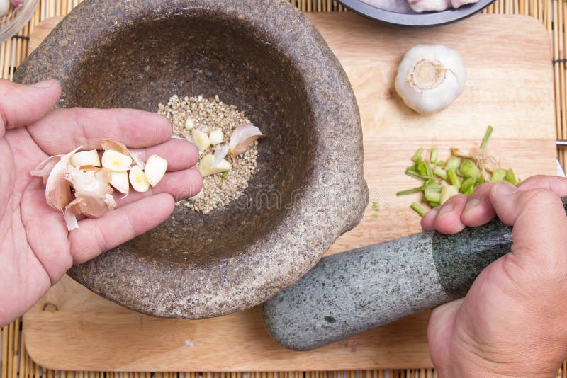 Chef Putting Garlic To Mortar Stock Photo - Image of garlic, asian ...