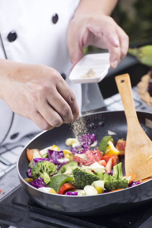 Chef Putting Pepper To the Pan Stock Photo - Image of culinary, hand ...