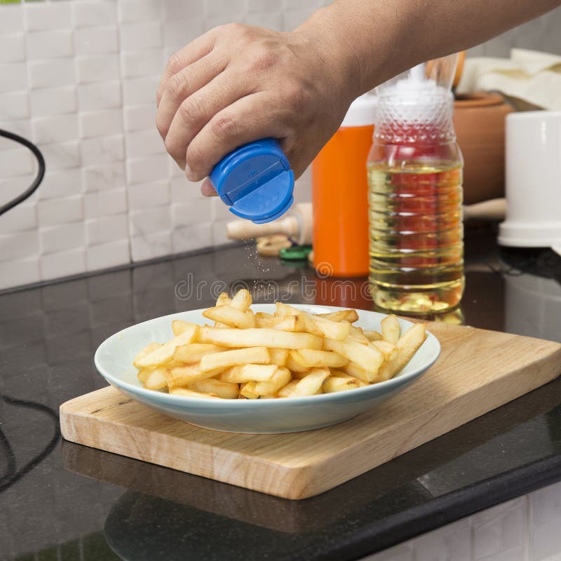 Chef Putting Salt To French Fired Stock Photo - Image of pour ...