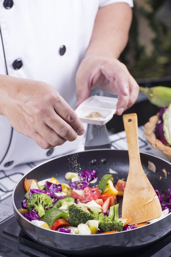 Chef Putting Salt To the Pan for Cooking Stock Image - Image of ...