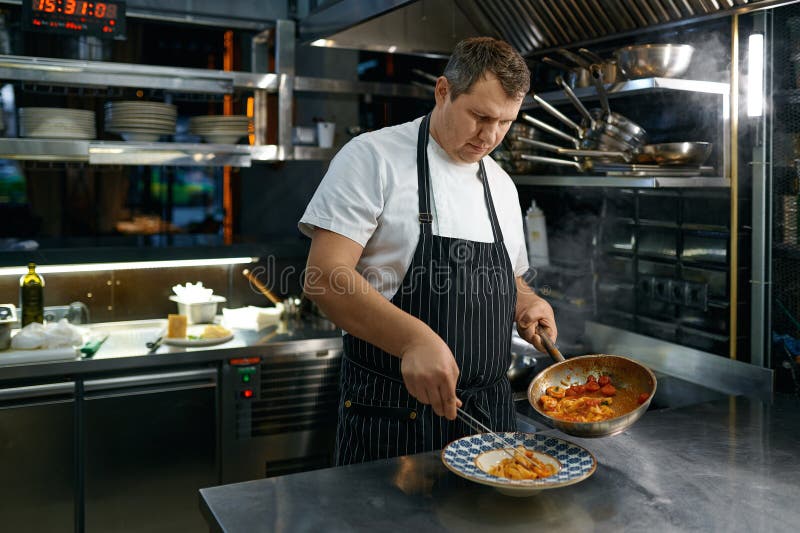 Chef Putting Spaghetti Carbonara on Plate Standing on Restaurant ...