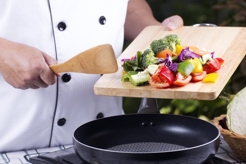 Chef Putting Vegetable To the Pan Stock Photo - Image of plate, dish ...