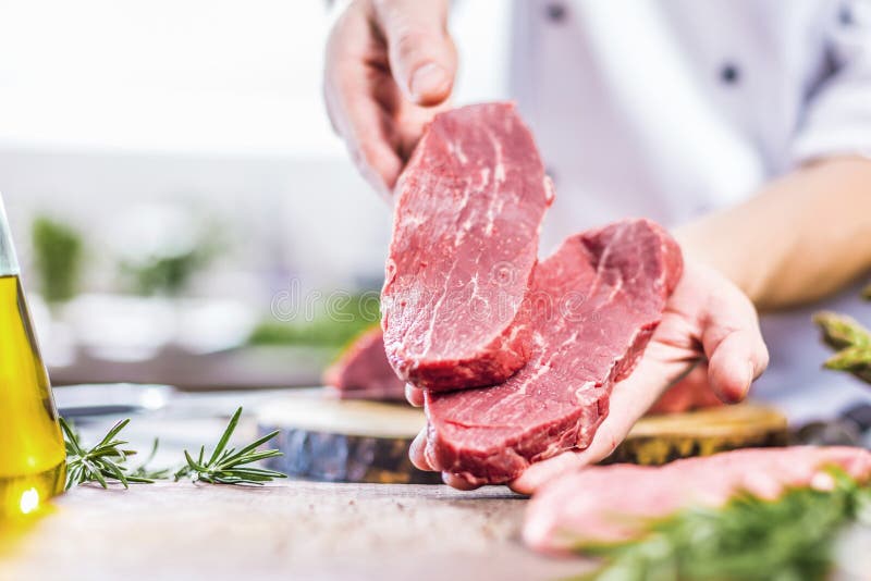 Chef Cutting and Cooking Meat in the Restaurant Kitchen Stock Image ...