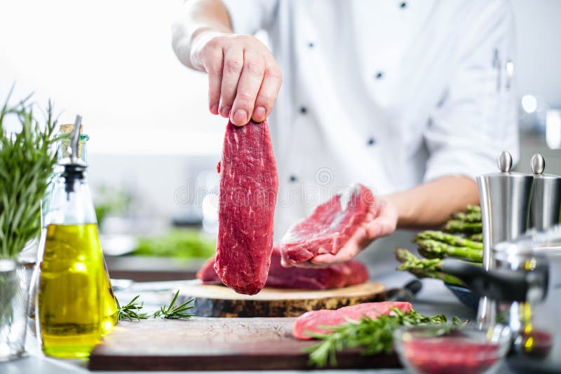 Chef Cutting and Cooking Meat in the Restaurant Kitchen Stock Image ...
