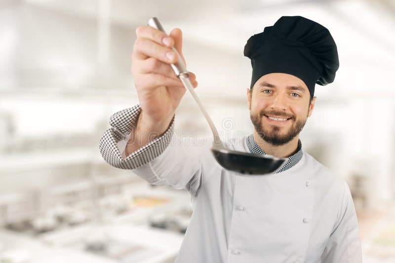 Chef in Restaurant Kitchen with Ladle in Hand Stock Photo - Image of ...