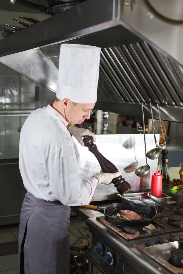 Chef in Restaurant Kitchen at Stove with Pan, Cooking Stock Photo ...