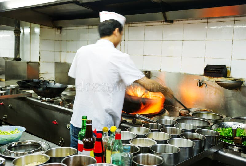 Chef in restaurant kitchen editorial photography. Image of fire - 50066597