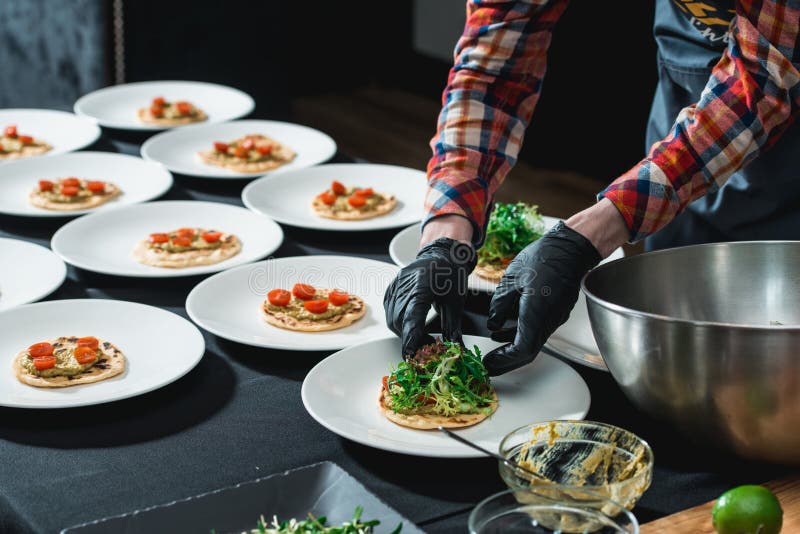 The Chef at the Restaurant Making Spicy Shrimp Tacos with Coleslaw and ...