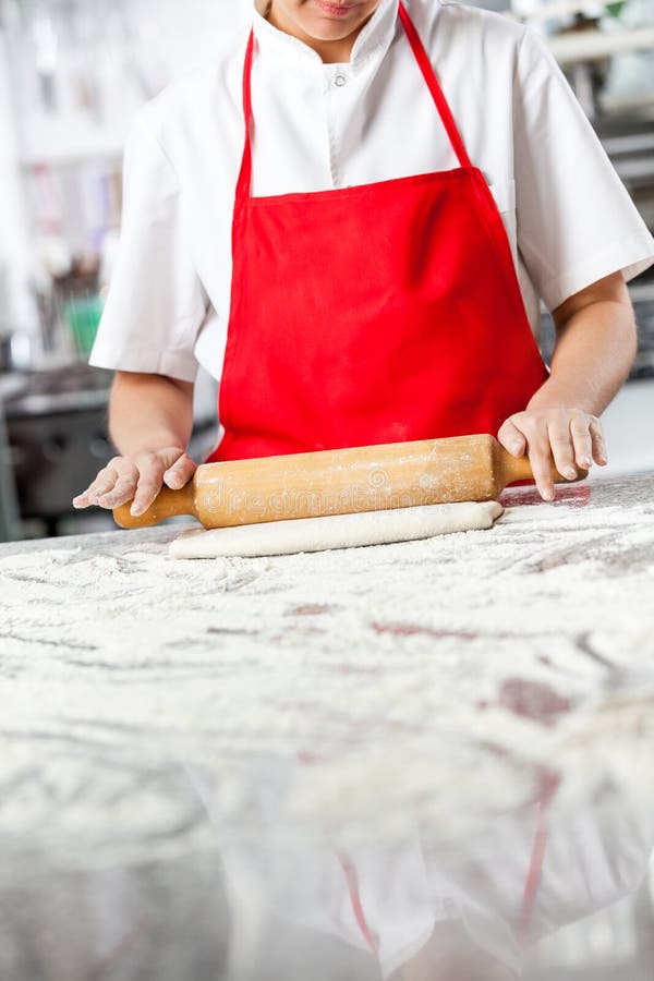 Chef Rolling Dough at Messy Counter Stock Image - Image of kitchen ...