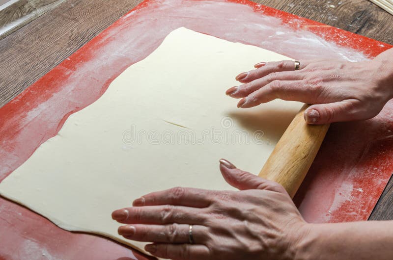 The Chef Rolls Out the Dough with a Rolling Pin Stock Photo - Image of ...