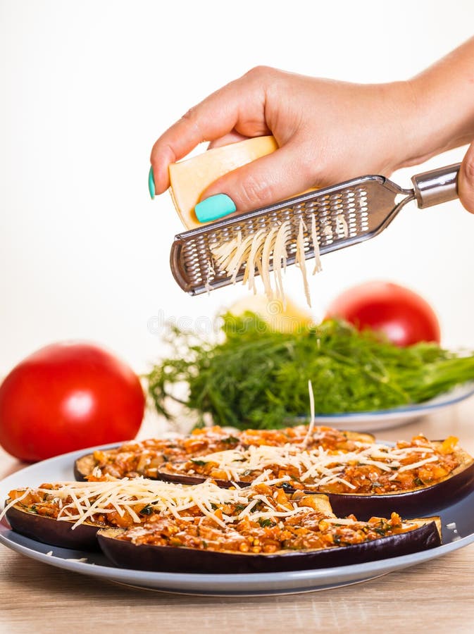 Chef is rubbing cheese stock image. Image of grilled - 96396489