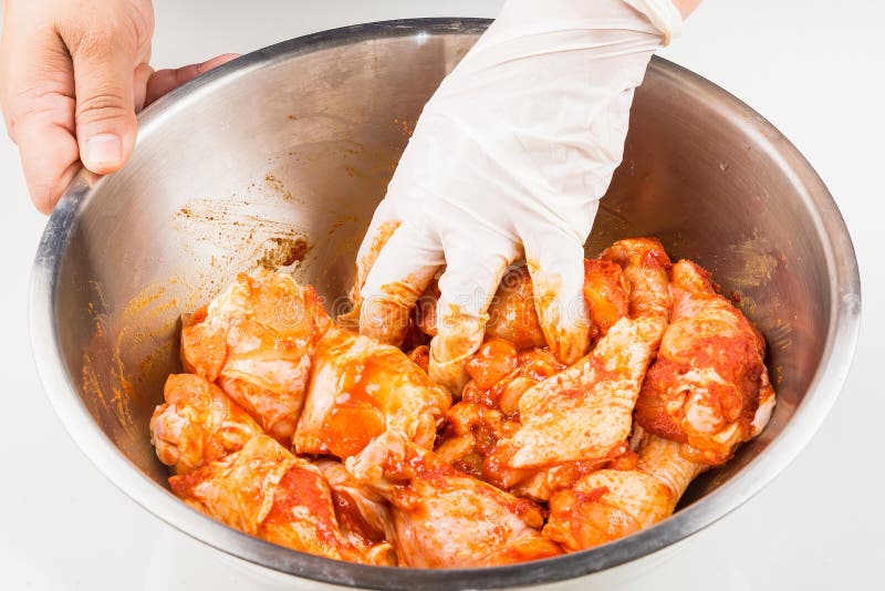 Chef`s Hand Mixing Chicken and Spicy Spice Powder . Making BBQ Chicken ... Chef`s Hand Mixing Chicken and Spicy Spice Powder . Making BBQ Chicken ...