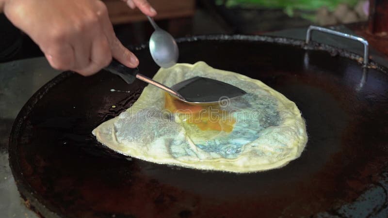 Chef S Hands Spreading Dough on Hot Oil and Dropping Egg Over it ...
