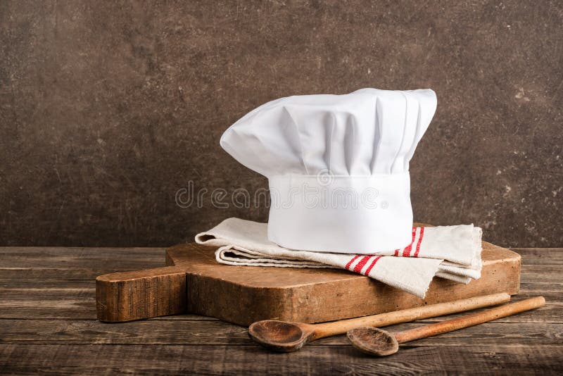 Chef`s Hat, Antique Cutting Board and Wooden Spoons Stock Photo - Image ...