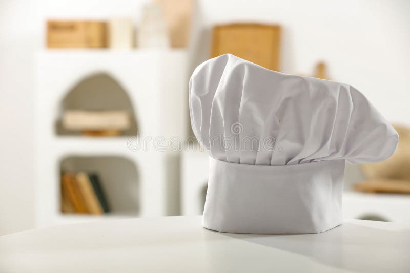 Chef S Hat on White Counter Table Top and White Kitchen Interior with ...