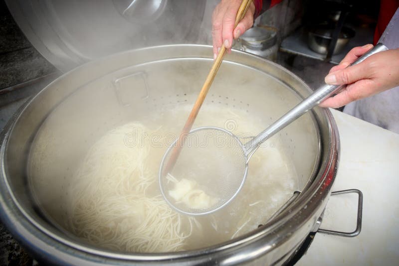 Chef is Scooping Cooked Noodles in Boiling Water in Pot Stock Photo ...