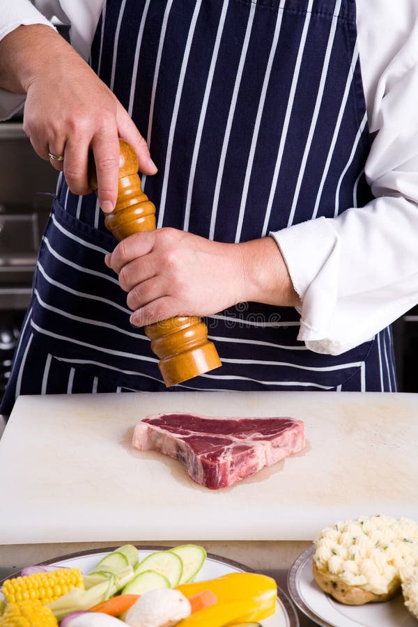 Chef seasons pork steak stock image. Image of chef, kitchen - 17055421