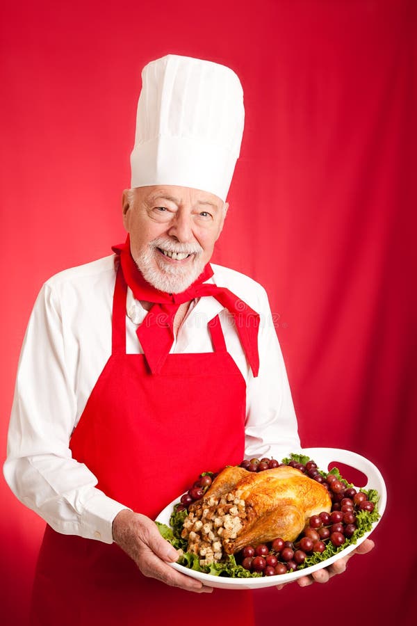 Chef Serves Holiday Dinner stock photo. Image of mature - 27205148