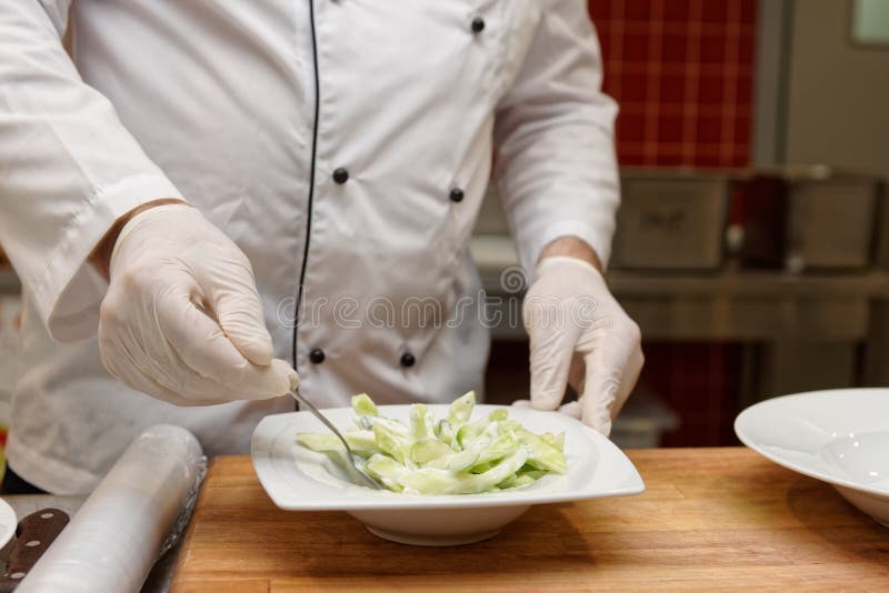 Chef is Serving Cucumber Salad Stock Image - Image of making, sanitary ...