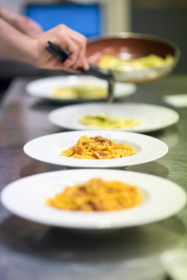 Chef Serving Ravioli Pasta in a Restaurant Kitchen Stock Image - Image ...