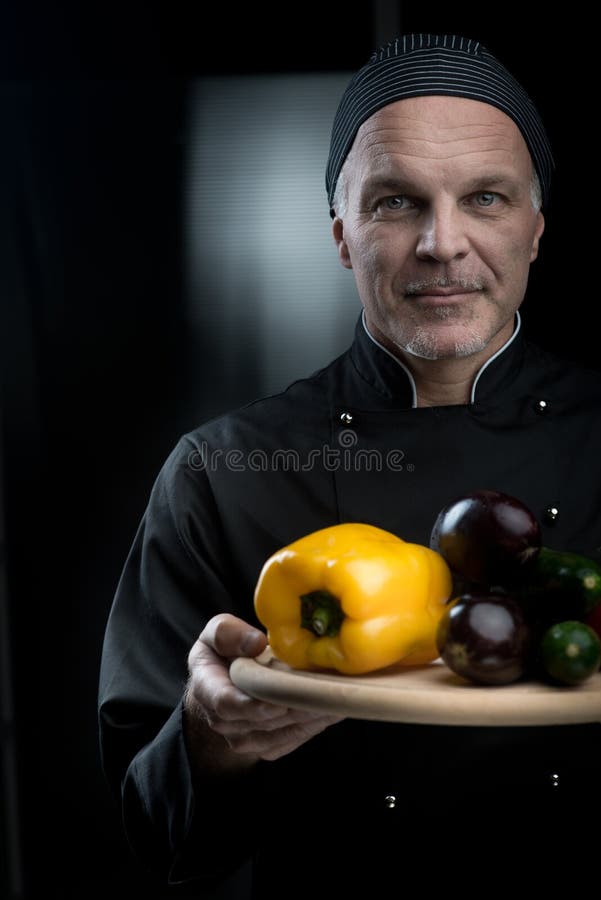 Chef Showing Vegetables on Cutting Board Stock Photo - Image of ...