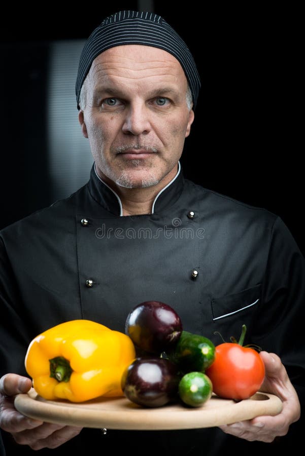 Chef Showing Vegetables on Cutting Board Stock Photo - Image of ...