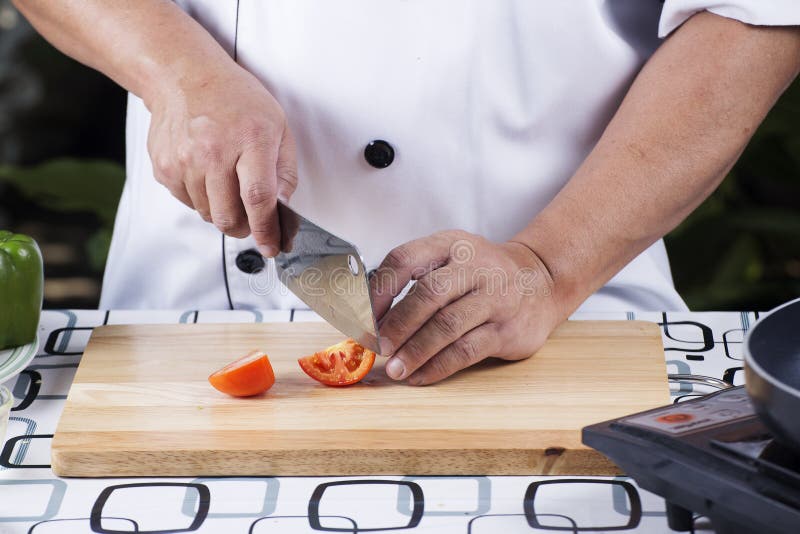 Chef Slice Tomato on Wooden Stock Image - Image of knife, cooking: 61564707