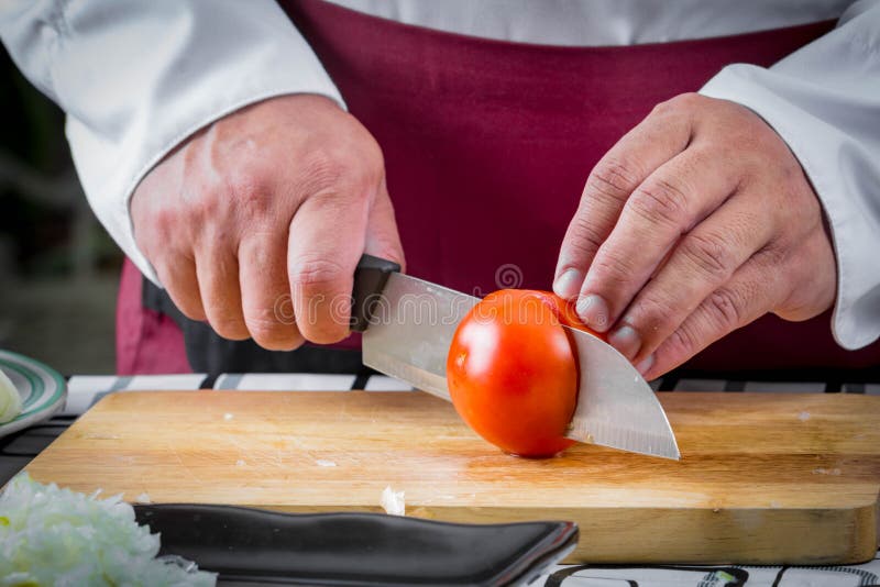Chef sliced tomato stock photo. Image of cookware, house - 83919918