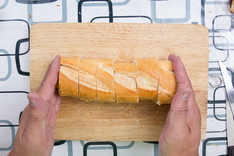 Chef slicing bread stock photo. Image of morning, cook - 75486846