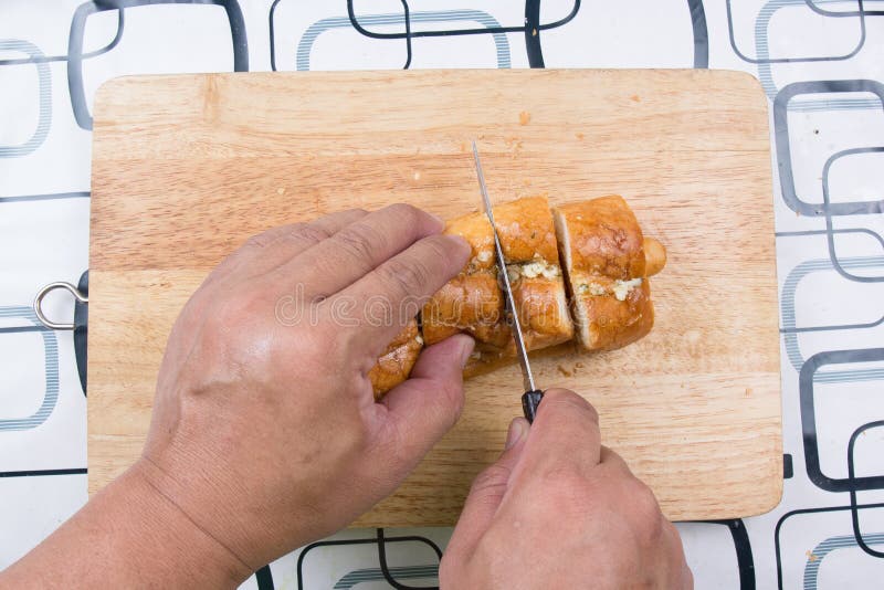 Chef slicing bread stock photo. Image of lunch, close - 77545008