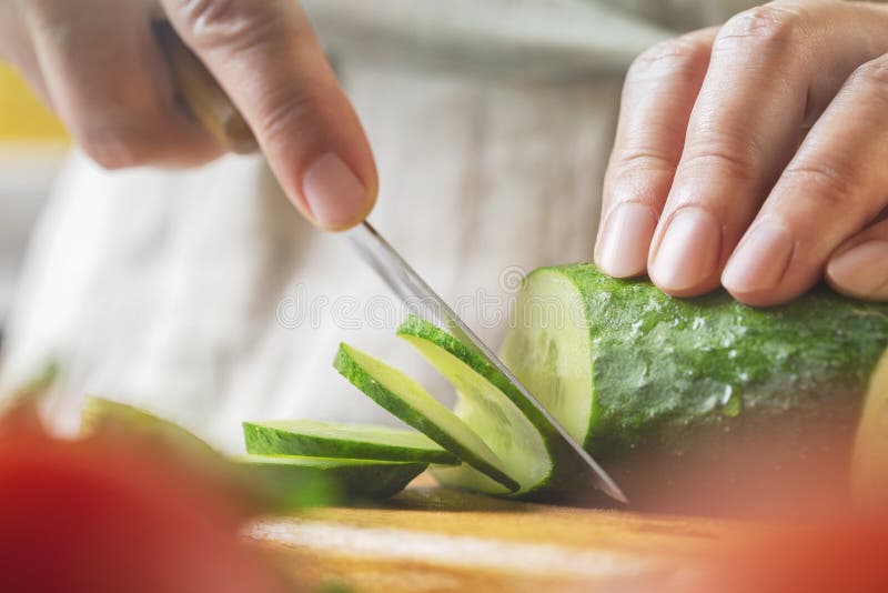 Cucumber on the table stock photo. Image of chopped - 211527070