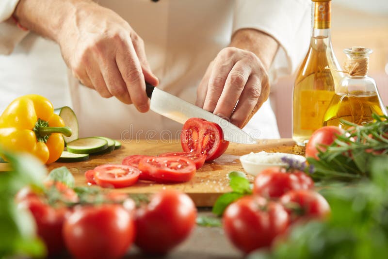 Chef Slicing Fresh Tomatoes for a Salad Stock Photo - Image of chef ...