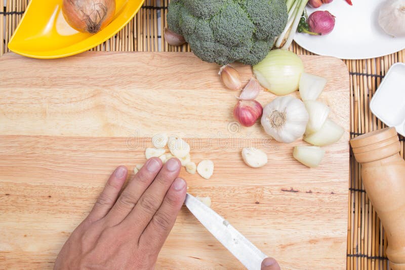 Chef is slicing garlic stock photo. Image of healthy - 82217892