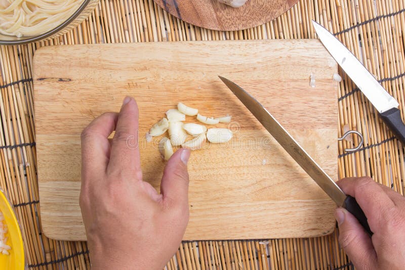 Chef Slicing Garlic with Knife Stock Photo - Image of close, cooking ...