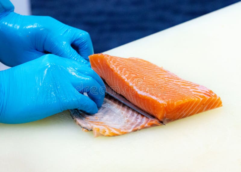 Chef Slicing Raw Fresh Salmon, Chef Preparing a Fresh Salmon on a ...